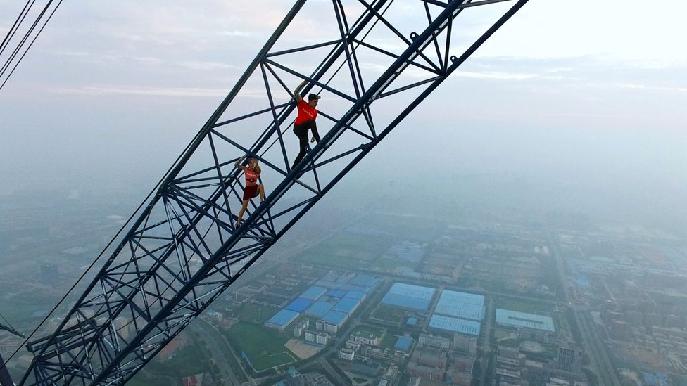 'Rooftopping is my art form': The death-defying couple who climb the ...
